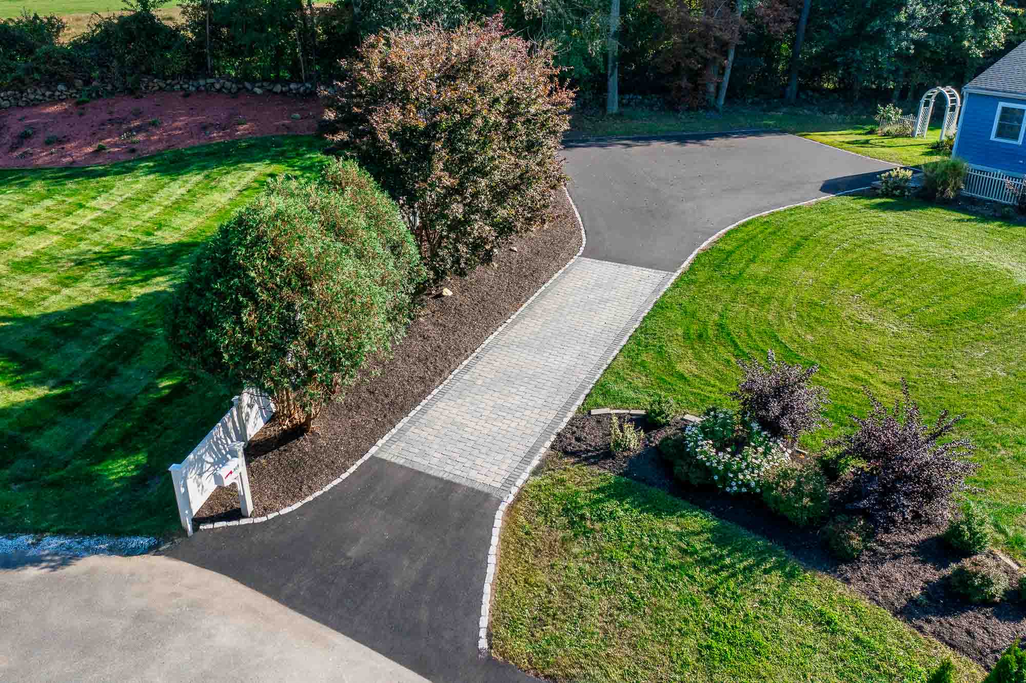 Crafting Durability and Elegance: Asphalt Meets Pavers for a Superior Driveway | CJ Pickering ...
